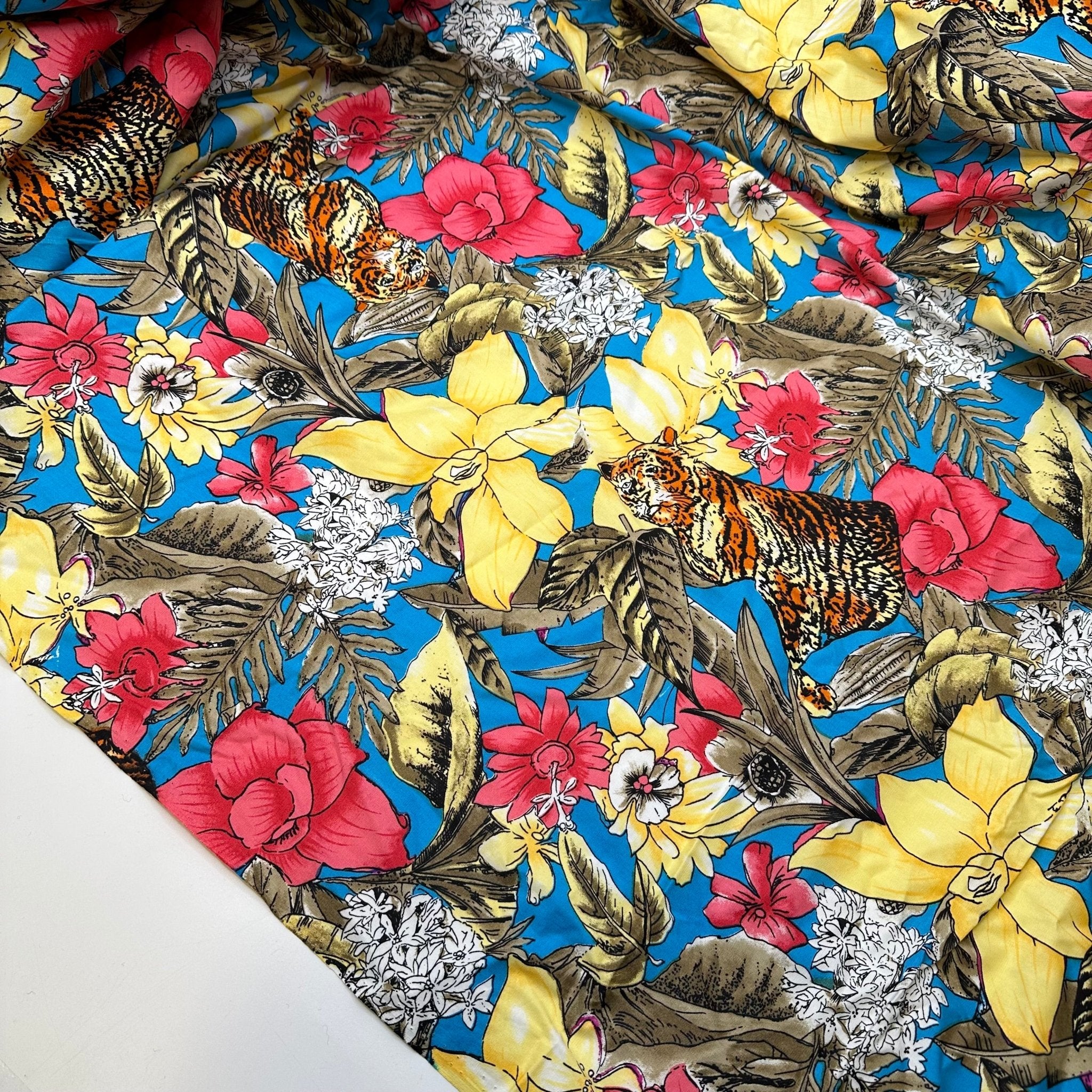 ub-on-the-prowl-cotton-woven-blue-multi-tiger-floral-29m-bundle-true ...